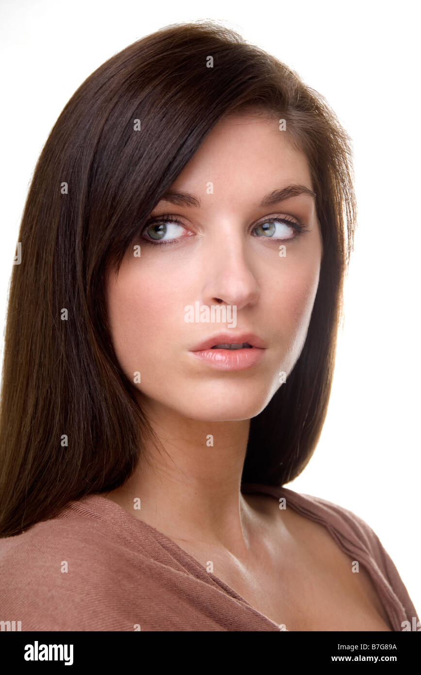 woman looking over her shoulder looking thoughtful Stock Photo - Alamy