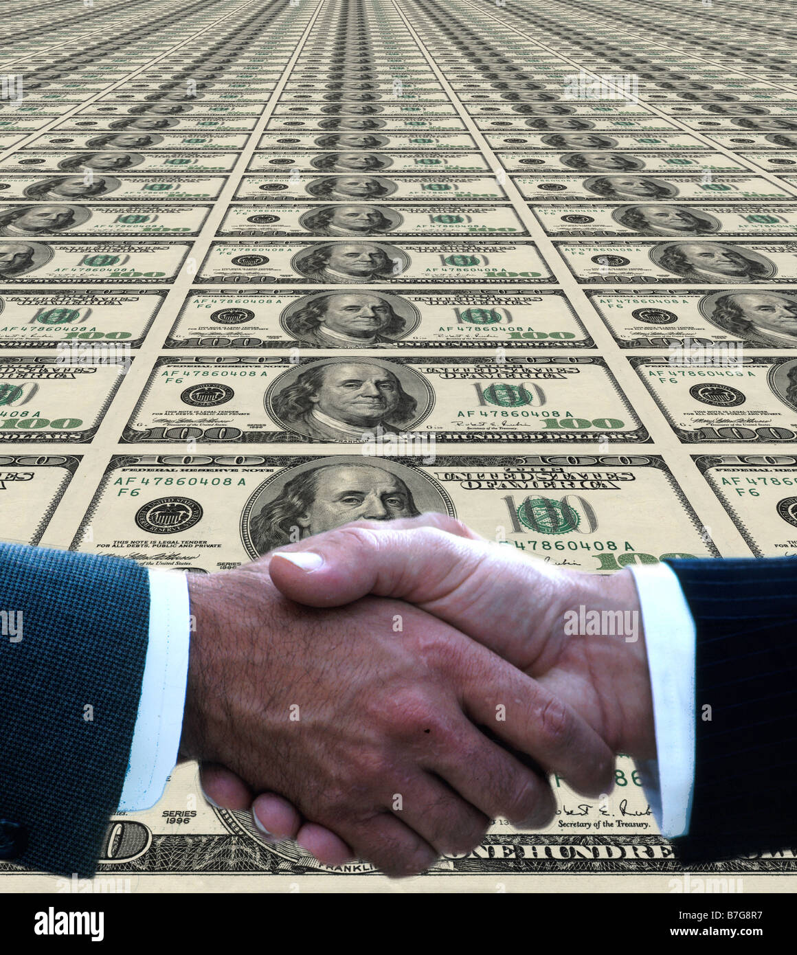 closeup businessmen shaking hands money background Stock Photo - Alamy