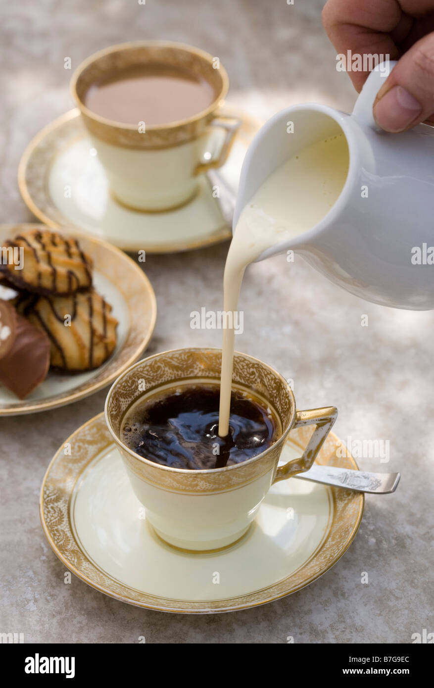 Pouring Cream Into Coffee