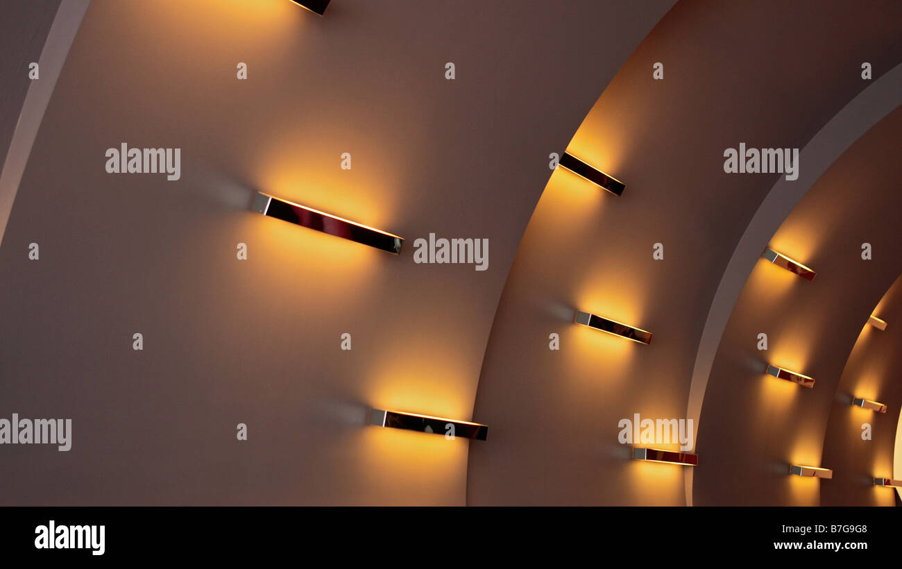 Curved wall with horizontal designer lights Stock Photo - Alamy