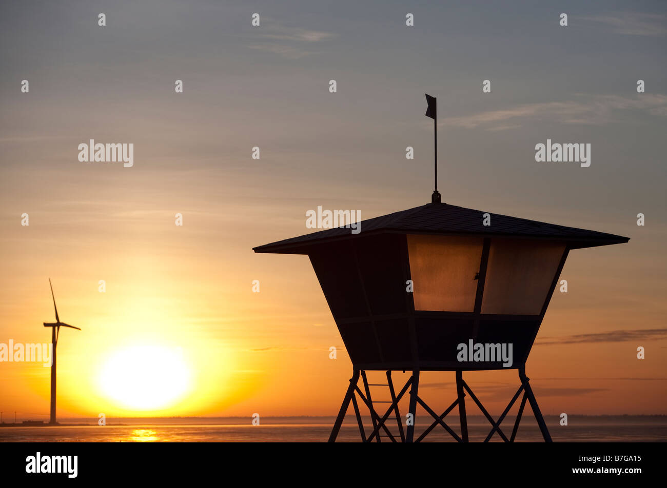 Windmill and lifeguard's watchtower at seashore , Finland Stock Photo ...