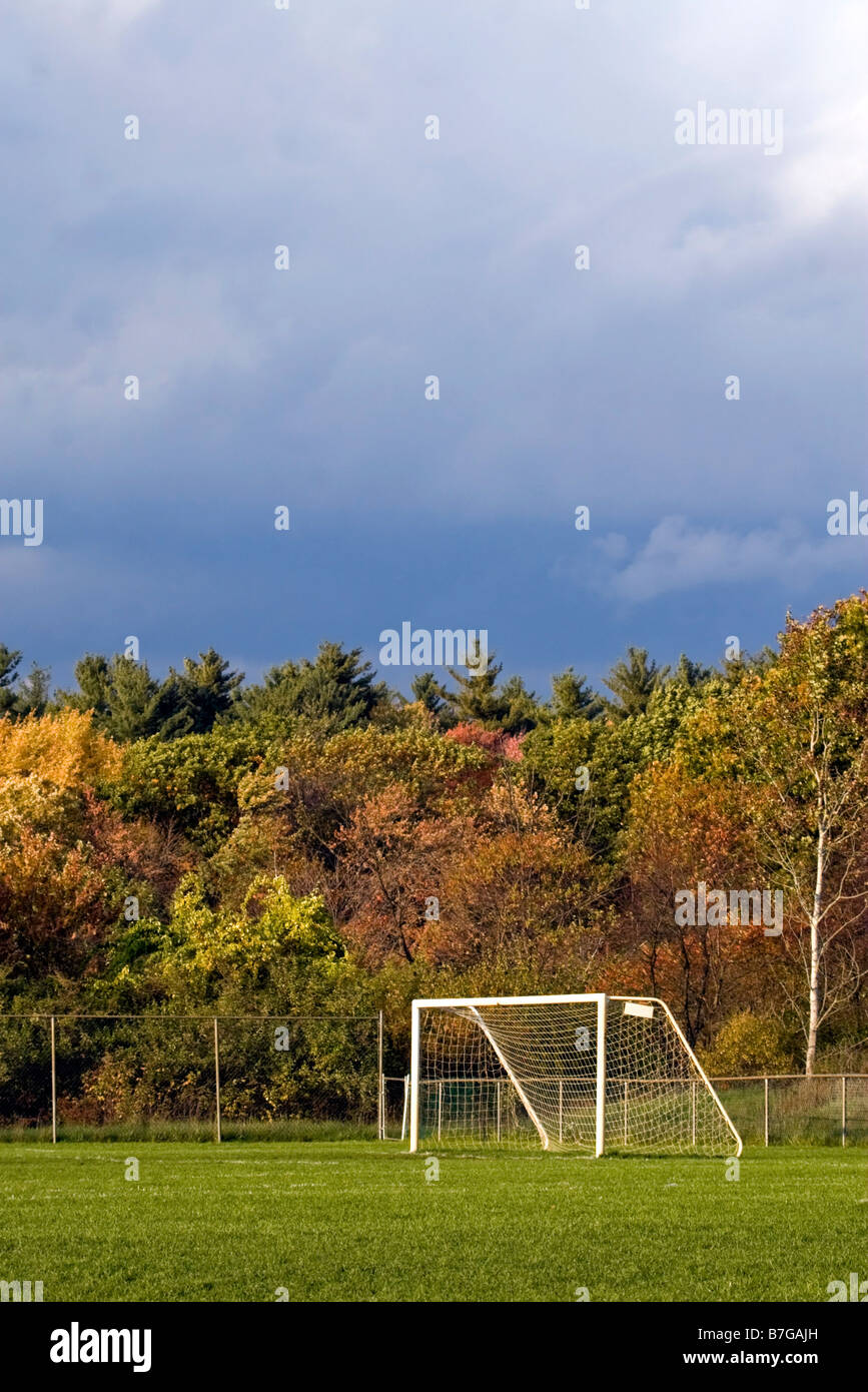 An empty soccer goal and net on the field at sunset in autumn Stock ...