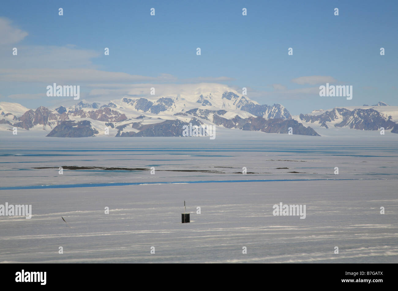Mount Bagshawe seen across the meltpools on George VI Sound, Antarctica ...