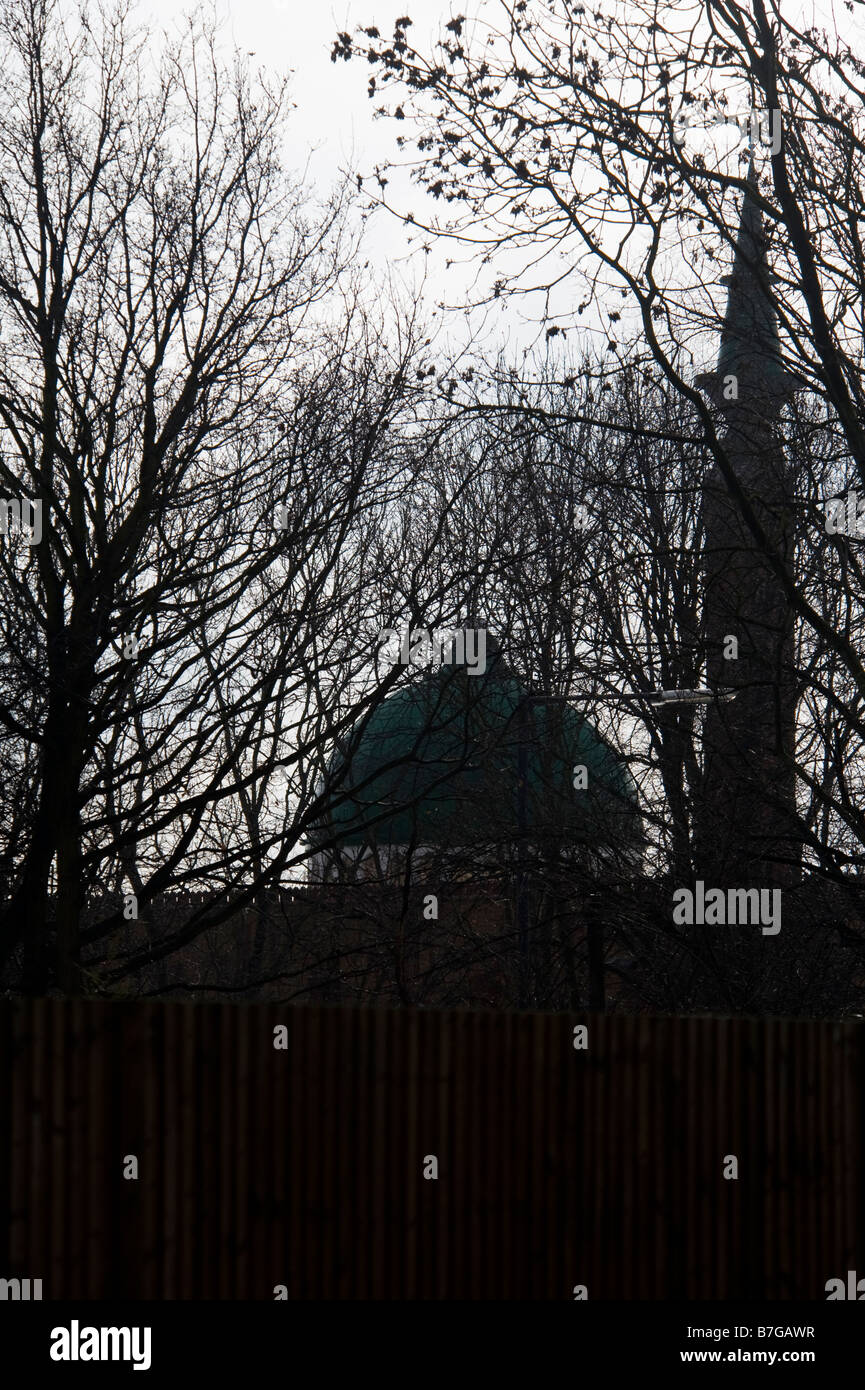 Dome of North Watford mosque and minaret seen through some winter trees ...