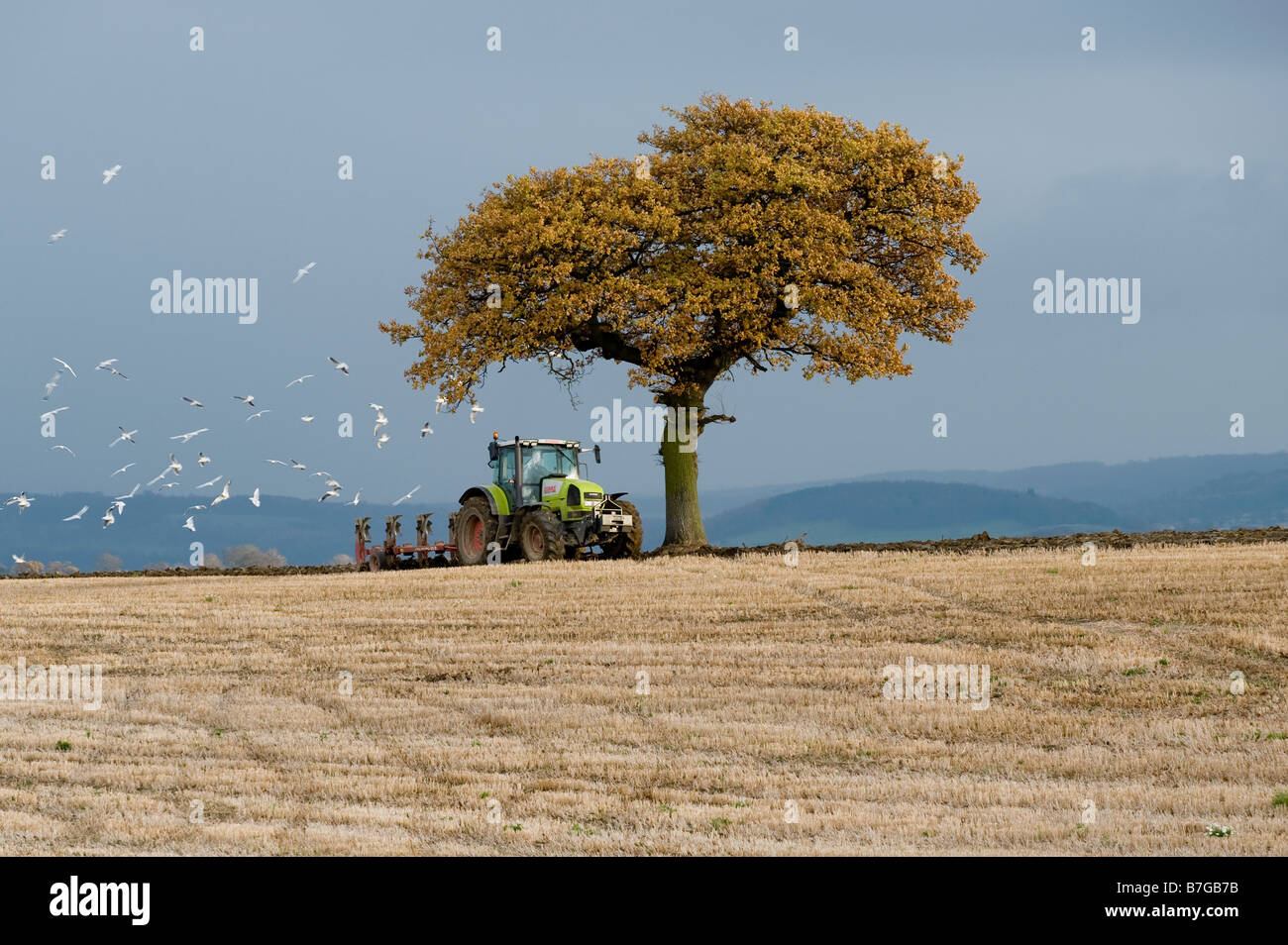 Side view of tractor with plough hi-res stock photography and images ...