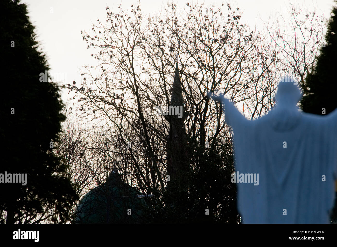 Jesus is watching over the North Watford mosque from the cemetery Stock ...