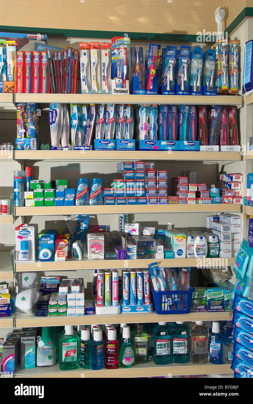 Shelves Stacked With Toothpaste and Tooth Brushes Stock Photo - Alamy