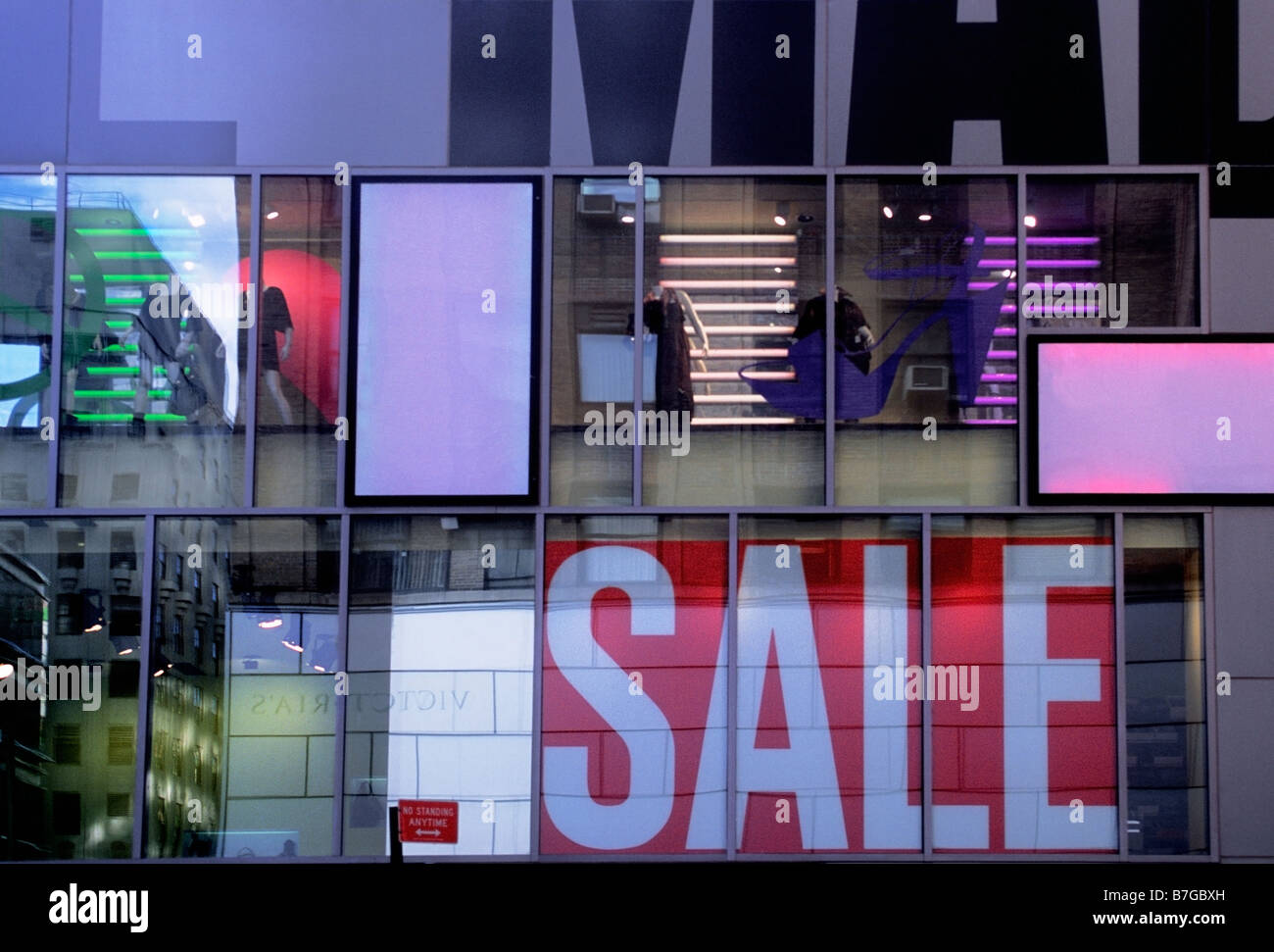 Clothing sale sign in ladies store window in New York City Stock Photo ...
