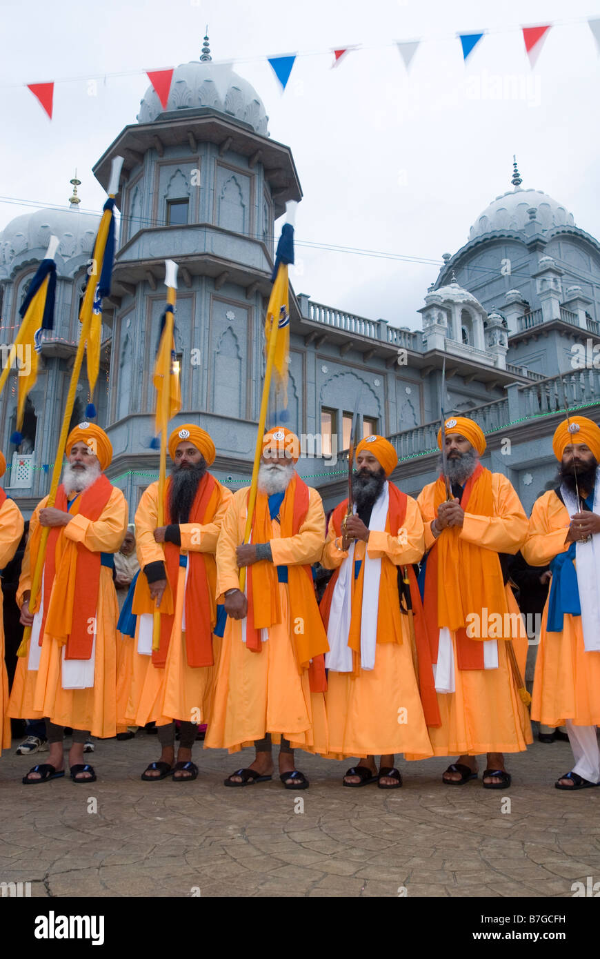 Sikh men parade in traditional costume at the festival of Guru Nanak ...