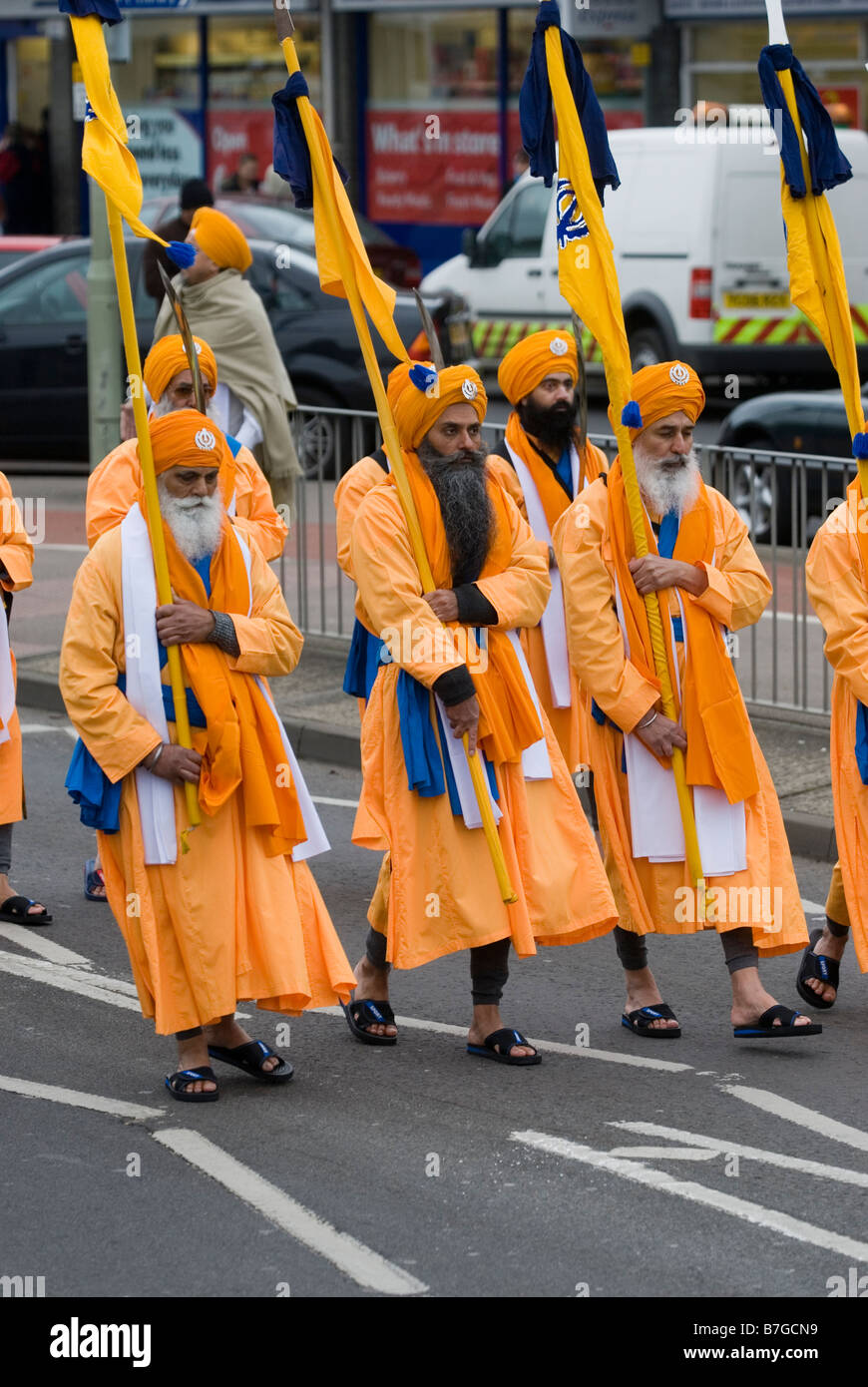 Sikh men parade in traditional costume at the festival of Guru Nanak ...