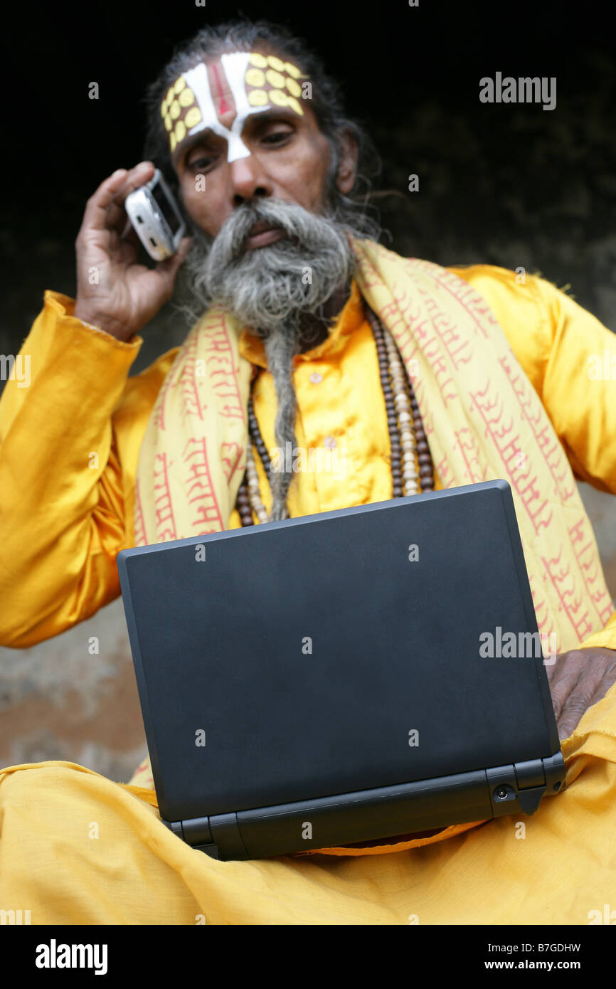“old man using a mobile phone and lap top” Stock Photo - Alamy