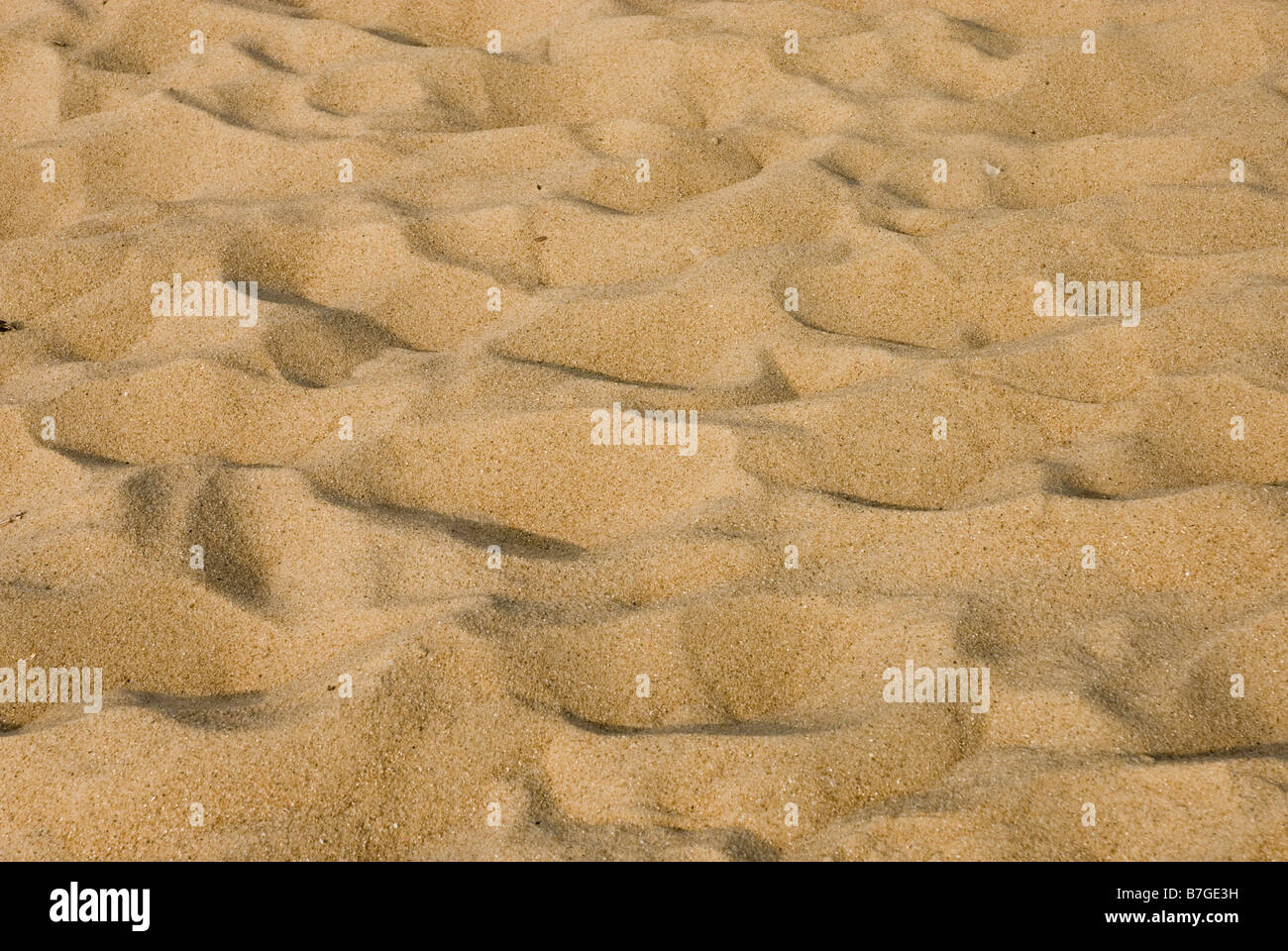 Many footprints in sand Stock Photo - Alamy