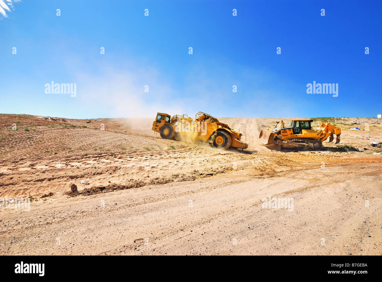 Two Earthmovers and the Terrain They Work Stock Photo - Alamy