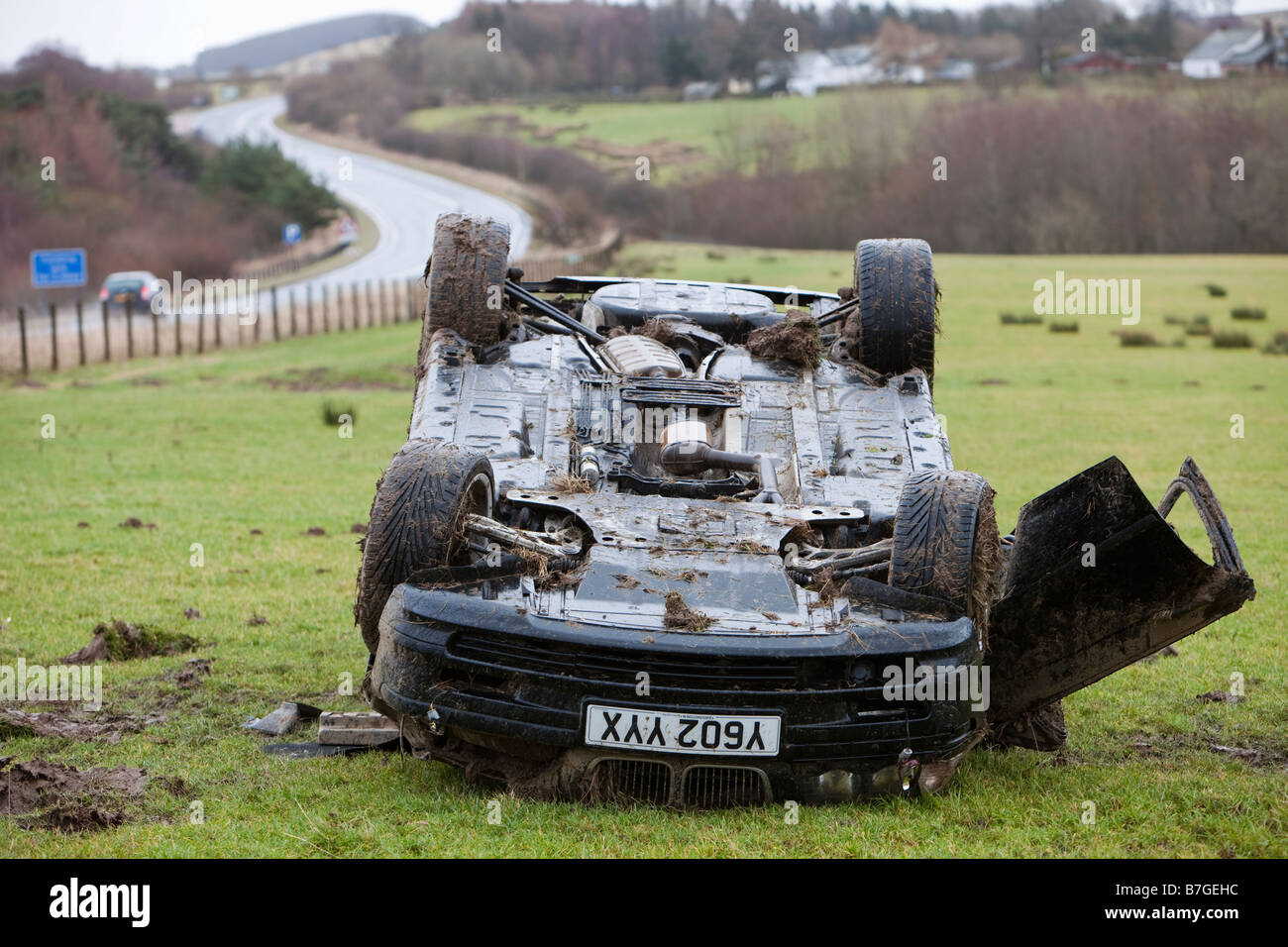 A BMW car crashed on its roof in the middle of a field after leaving ...
