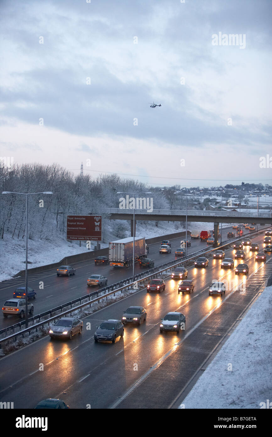 Cars on M62 motorway in Leeds in winter with snow on ground Stock Photo ...