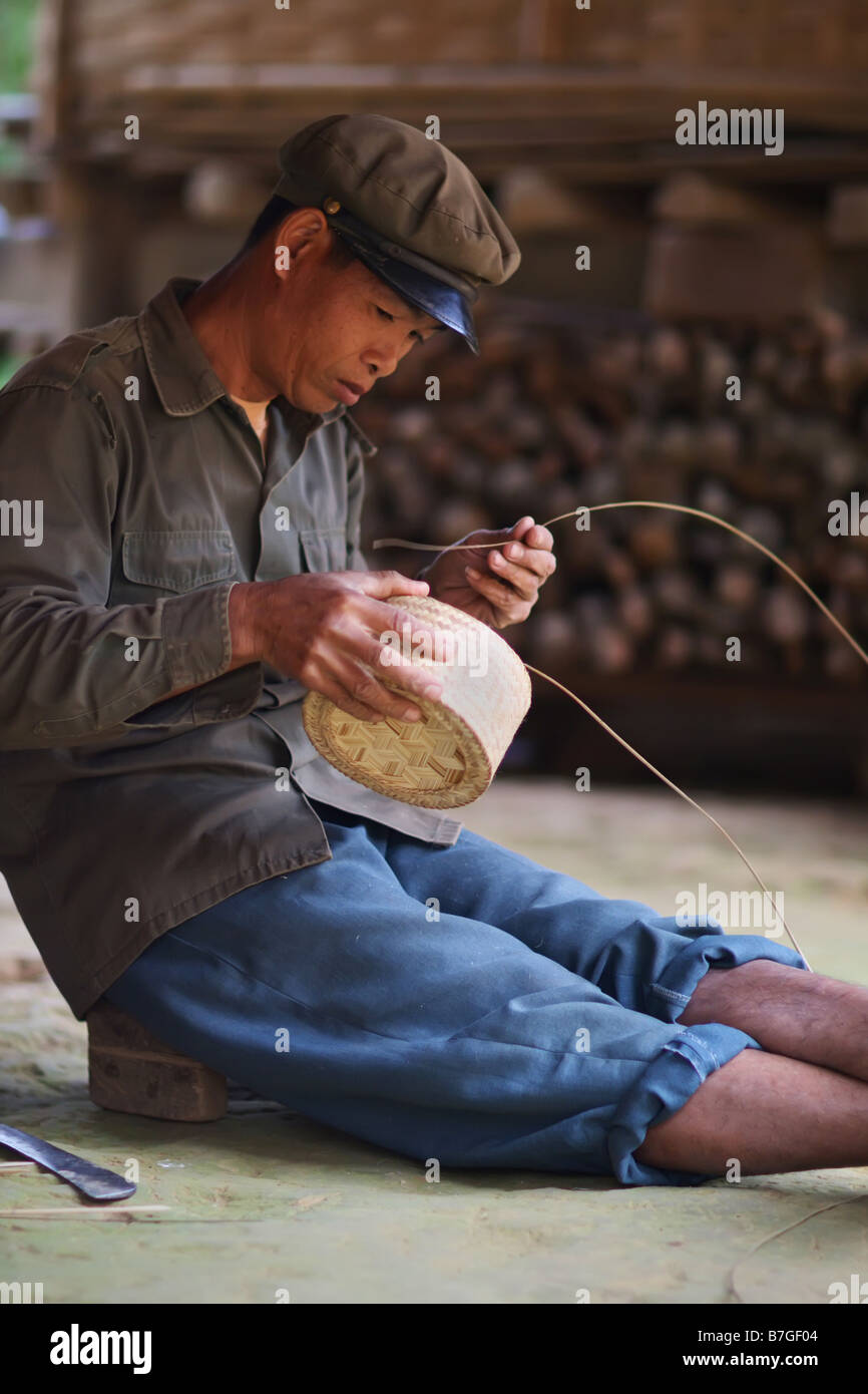 Village man weaving basket Stock Photo - Alamy