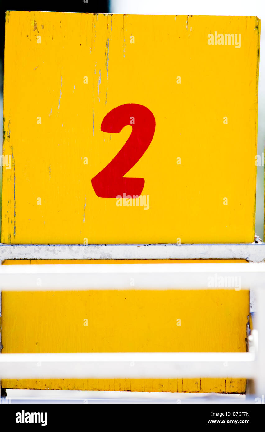 Painted red number 2 yellow wood Stock Photo - Alamy