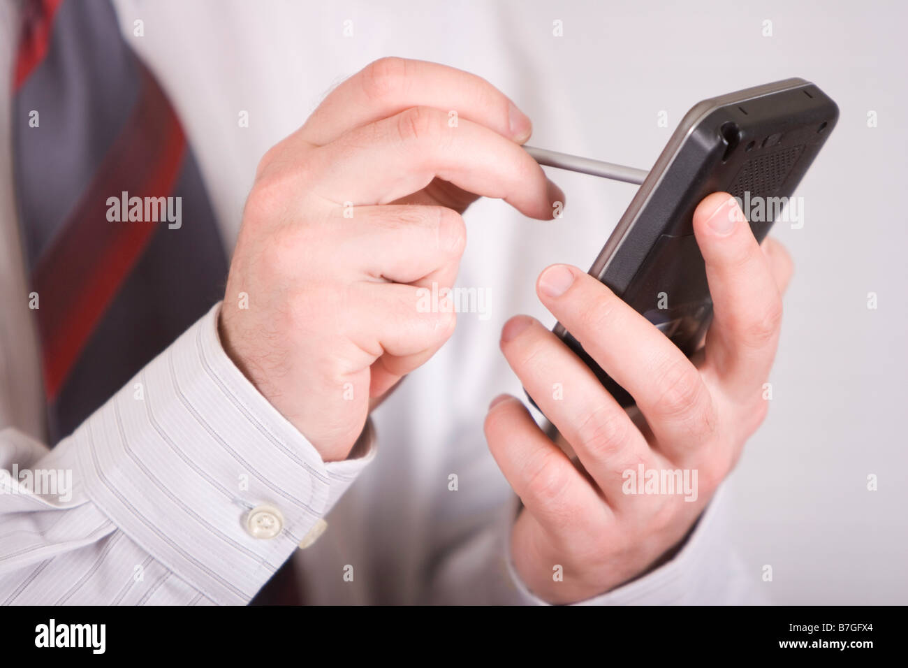 Businessman is working on PDA Stock Photo - Alamy