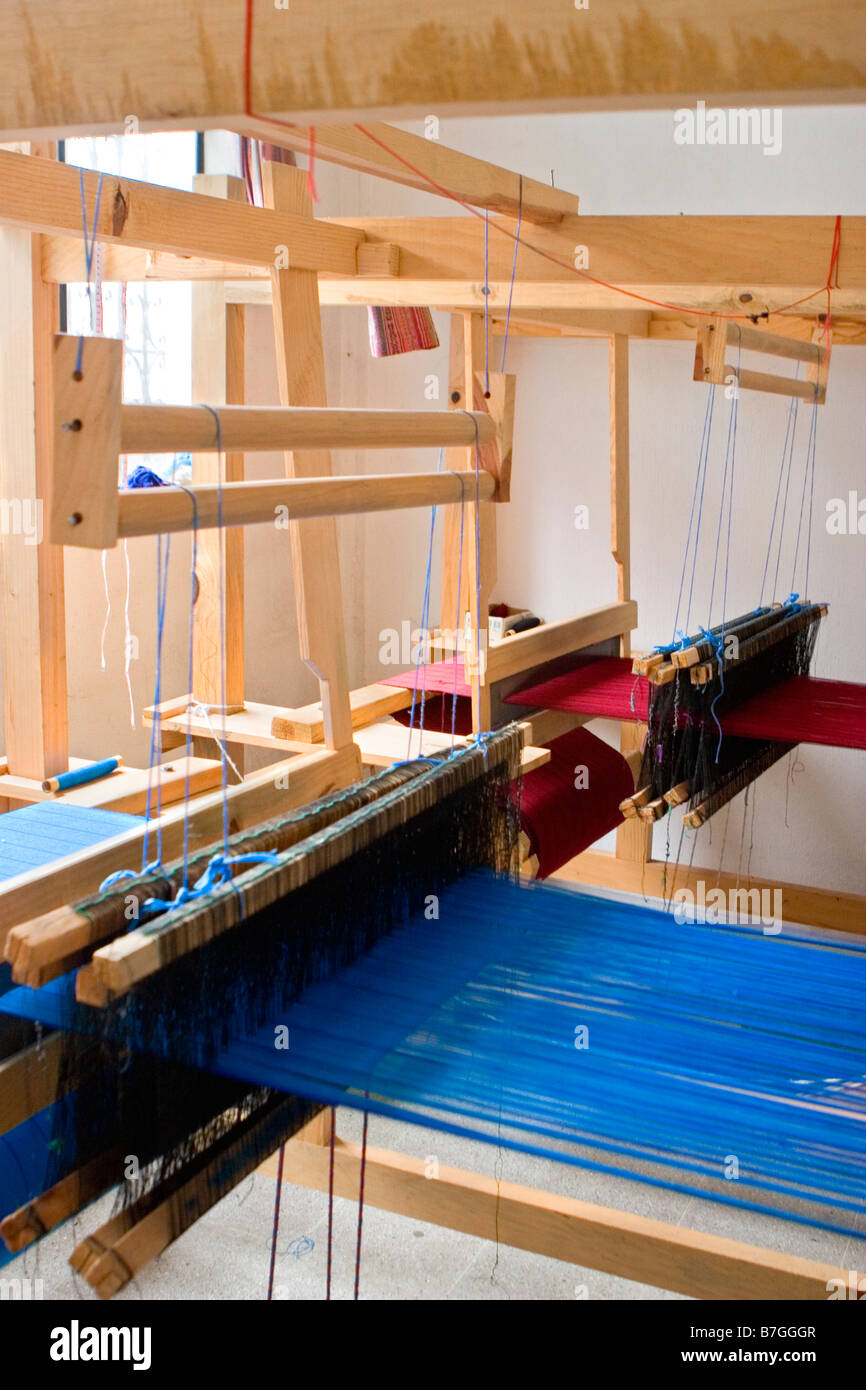 Large free standing loom with bright blue yarn in a woman s cooperative ...