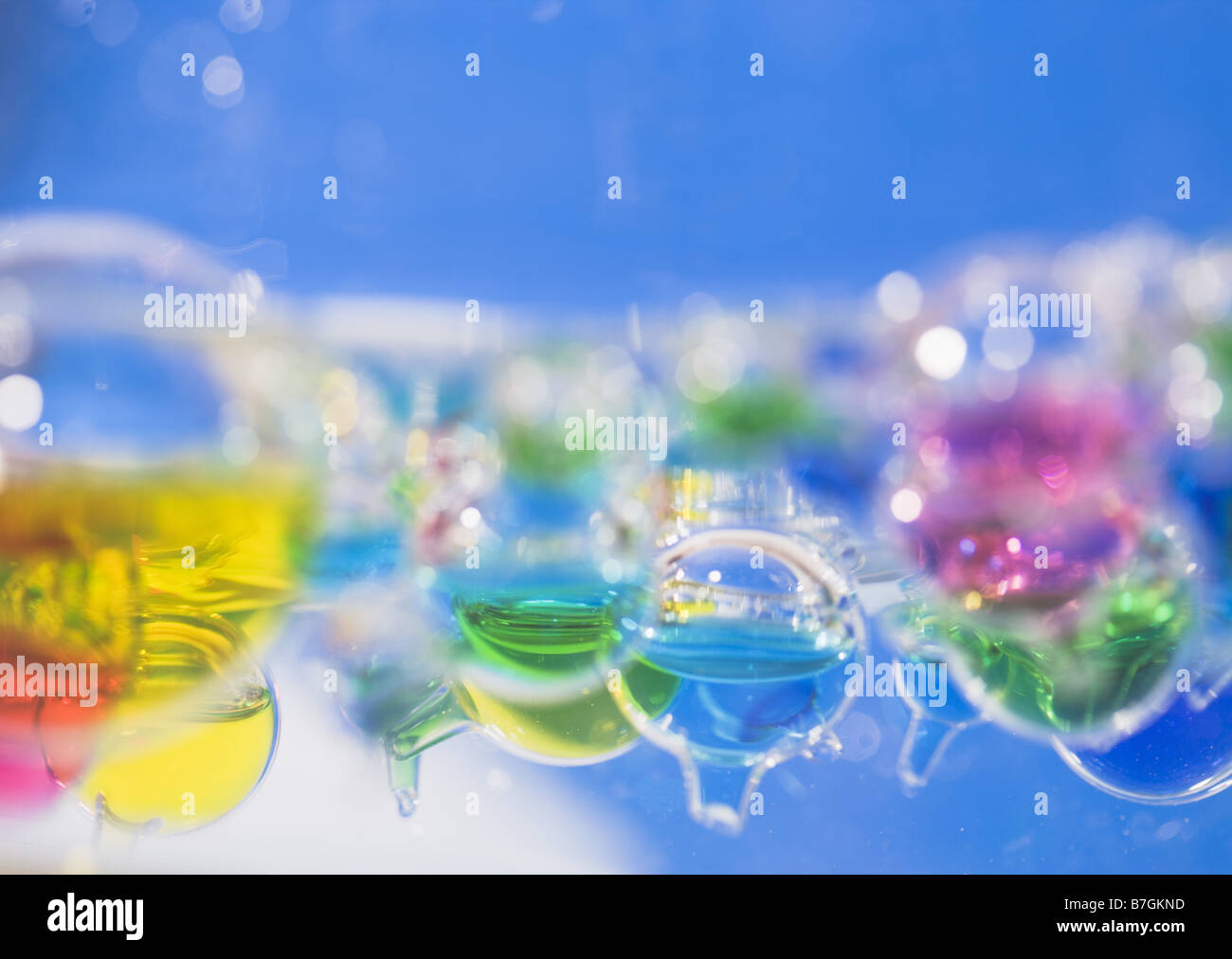 Glass balls floating on water Stock Photo - Alamy