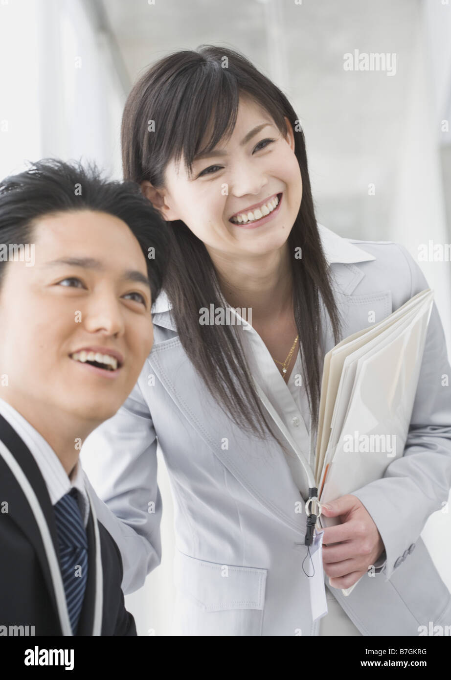 Smiling businessmen in the office Stock Photo - Alamy