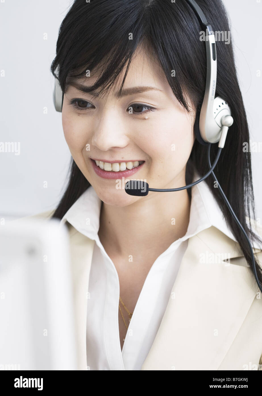 Smiling operator the office Stock Photo - Alamy