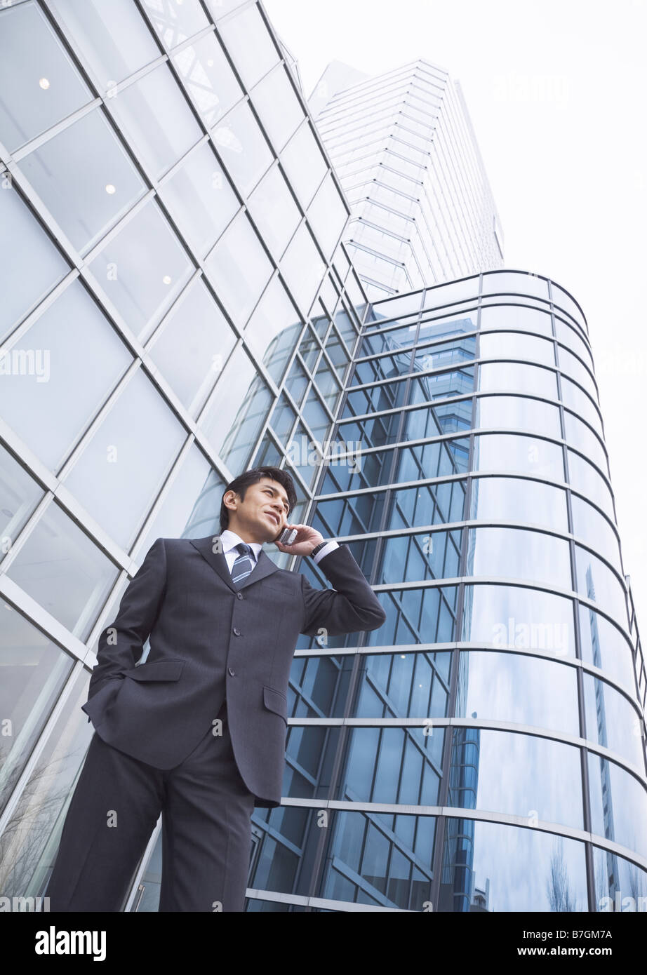 Man using cell-phone at outside of building Stock Photo - Alamy