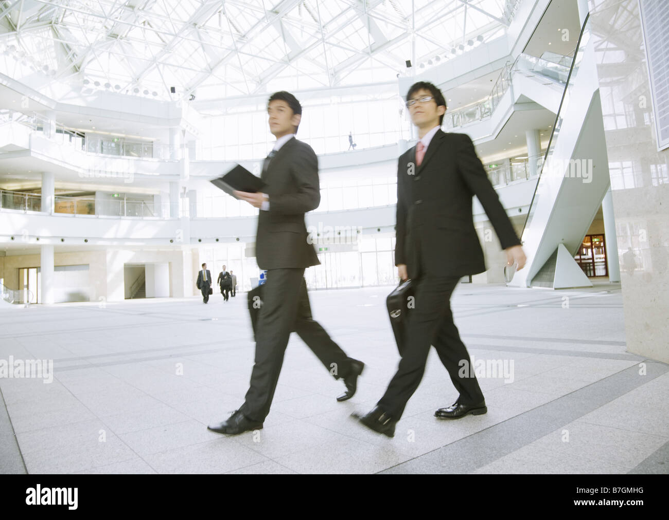 Group business people exiting building hi-res stock photography and ...
