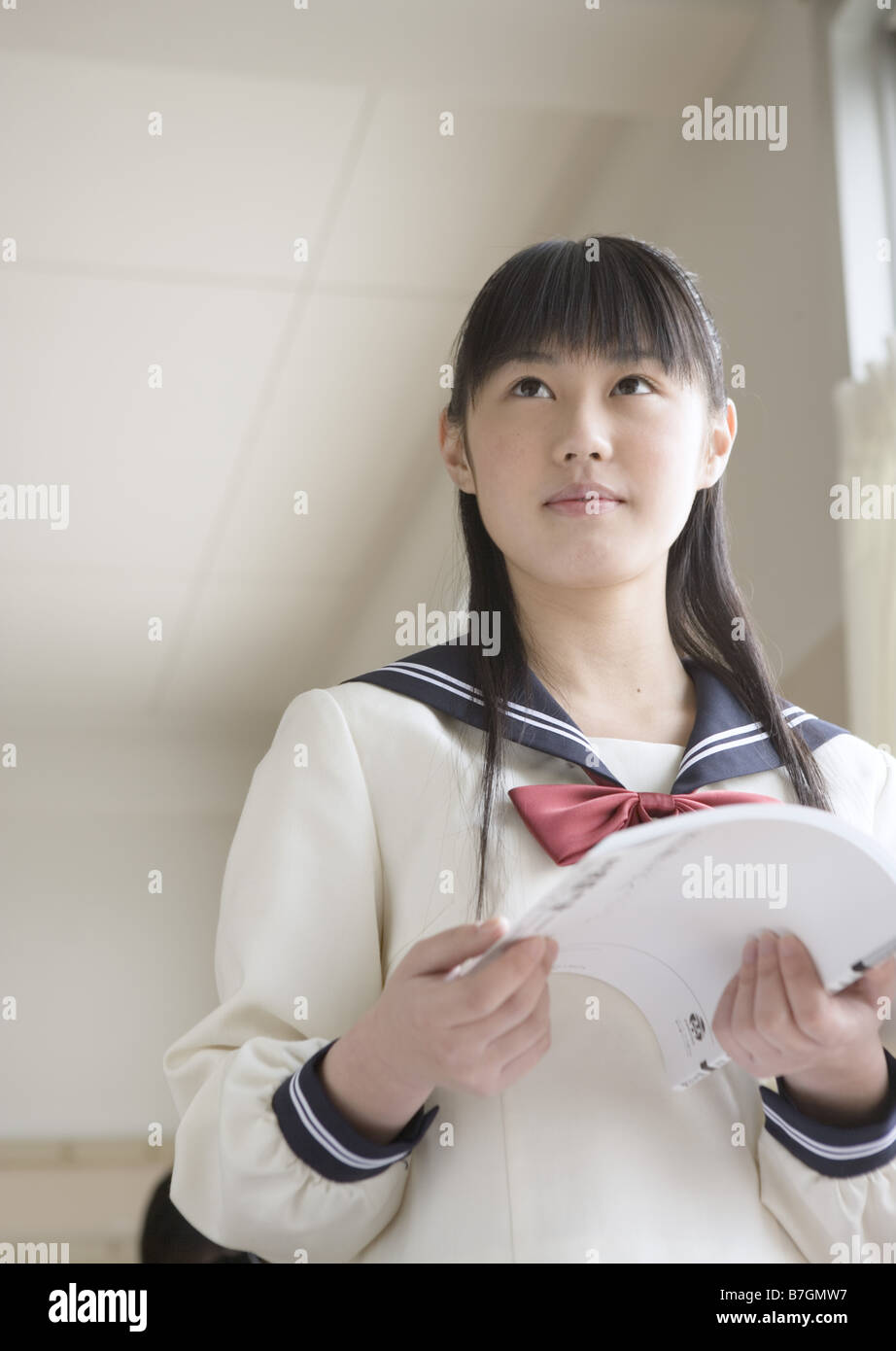 Junior high school girl reading book hi-res stock photography and ...