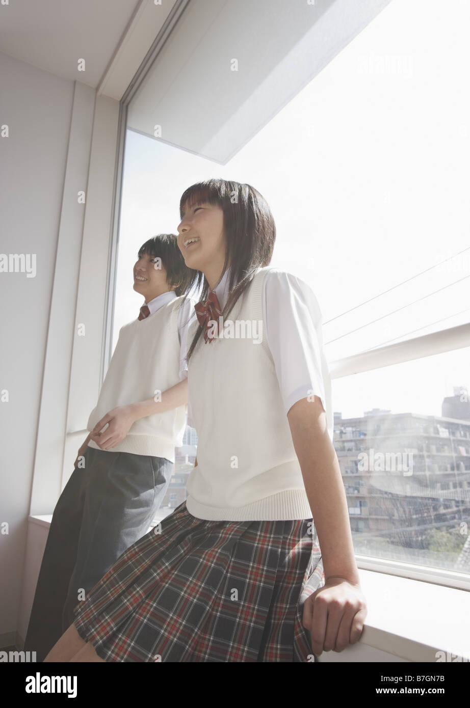 Teenagers talking in classroom Stock Photo - Alamy