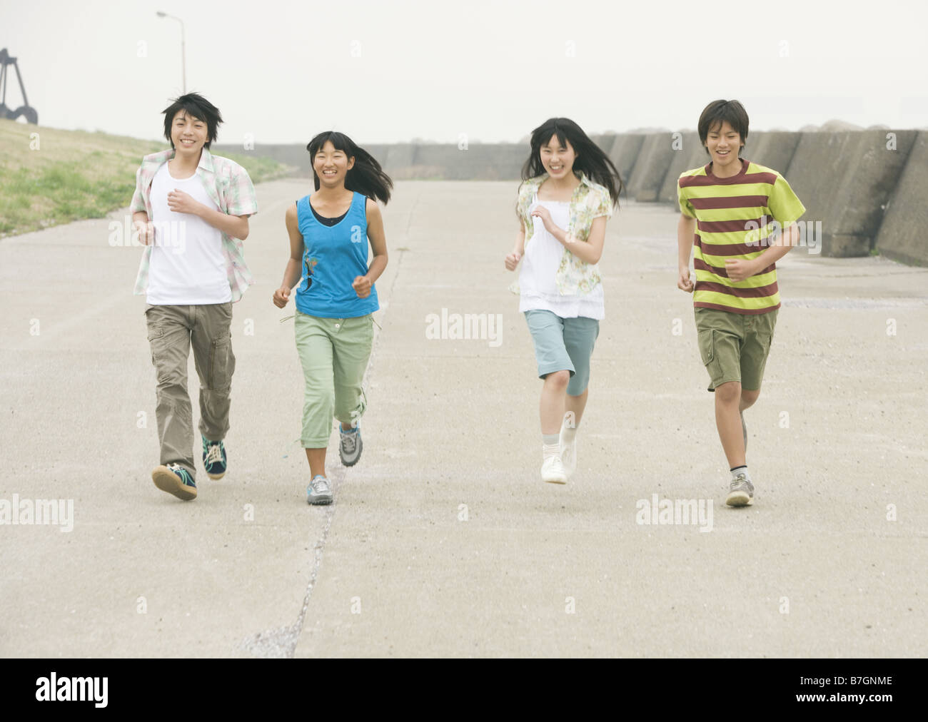 Running with friends Stock Photo - Alamy