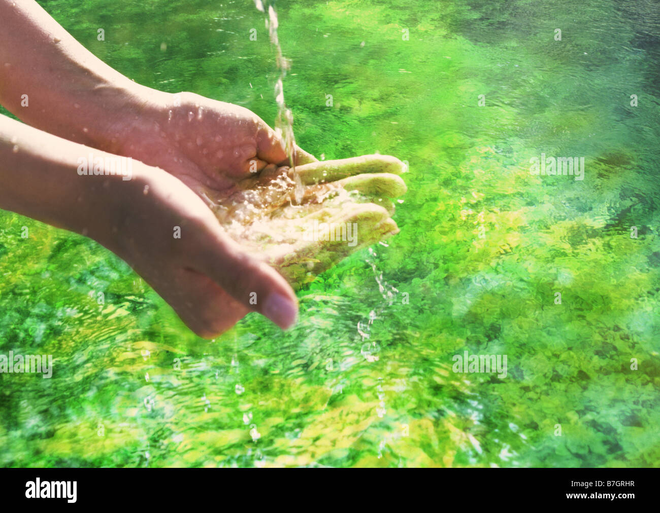 Hands scooping up water Stock Photo - Alamy