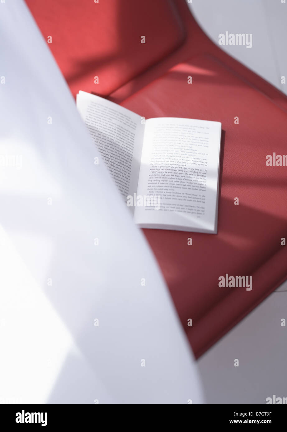 Book on chair Stock Photo - Alamy