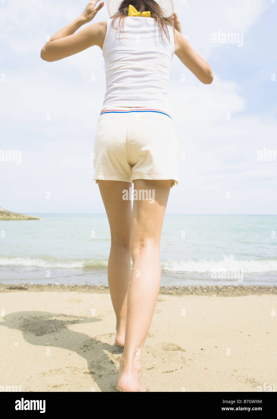 Woman on the sandy beach Stock Photo - Alamy