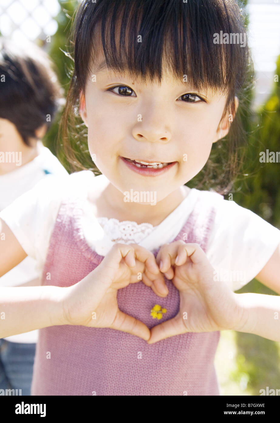 Girls hands making heart hi-res stock photography and images - Alamy