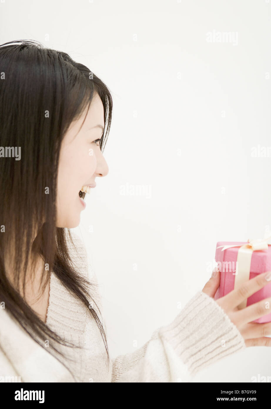 Woman Offering Present Stock Photo - Alamy