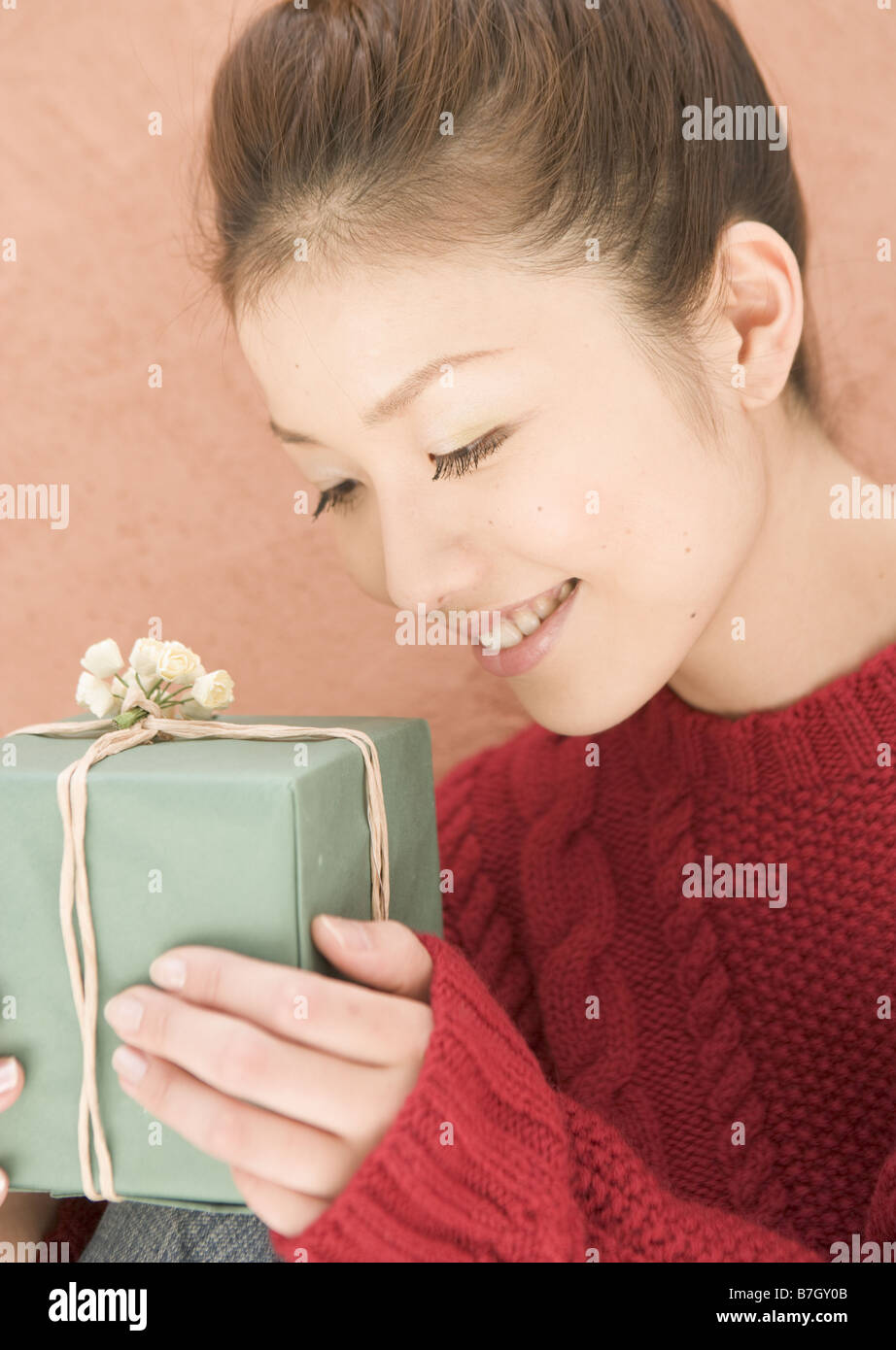 Woman with Present Stock Photo - Alamy