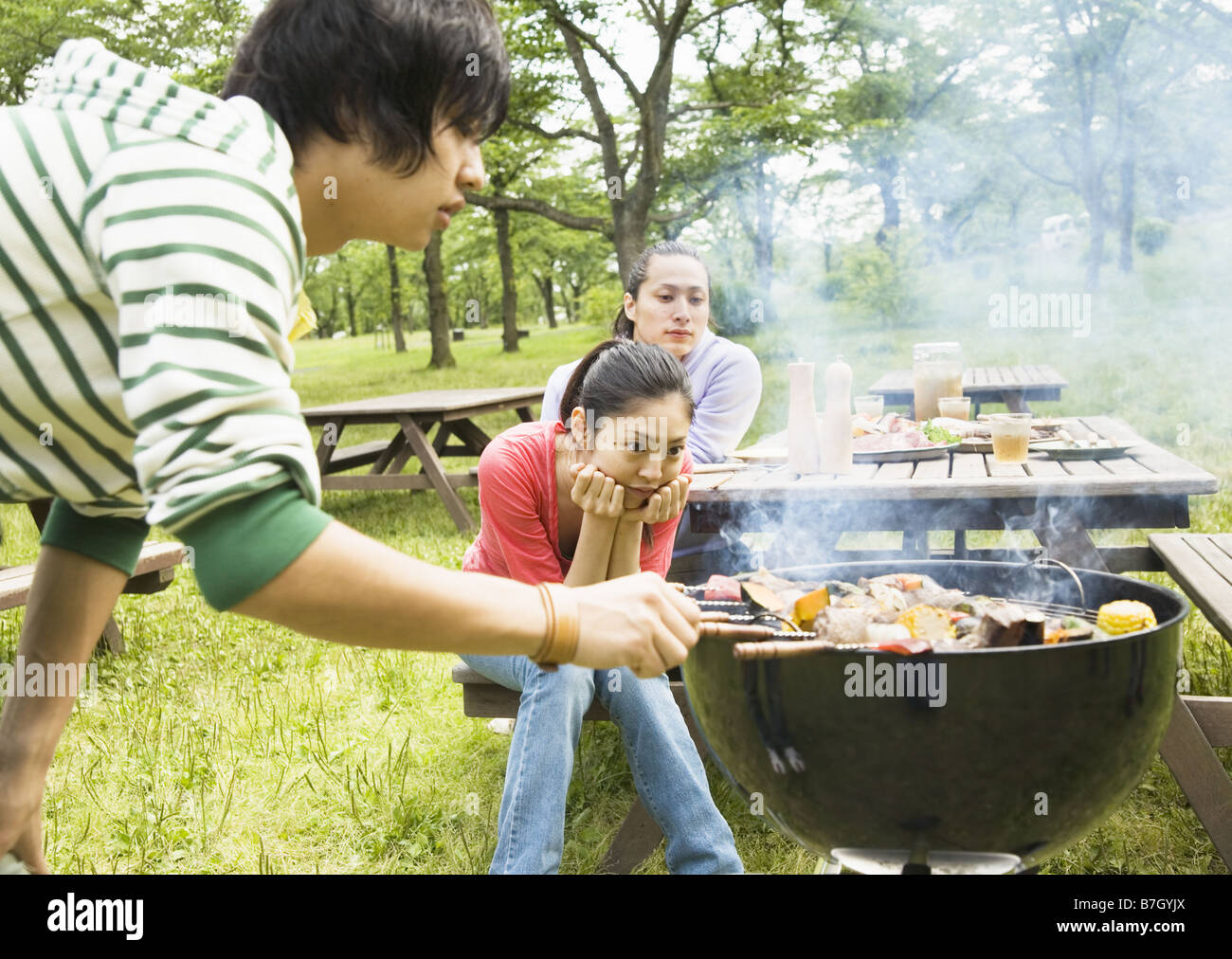Young woman hand hair picnic table hi-res stock photography and images ...