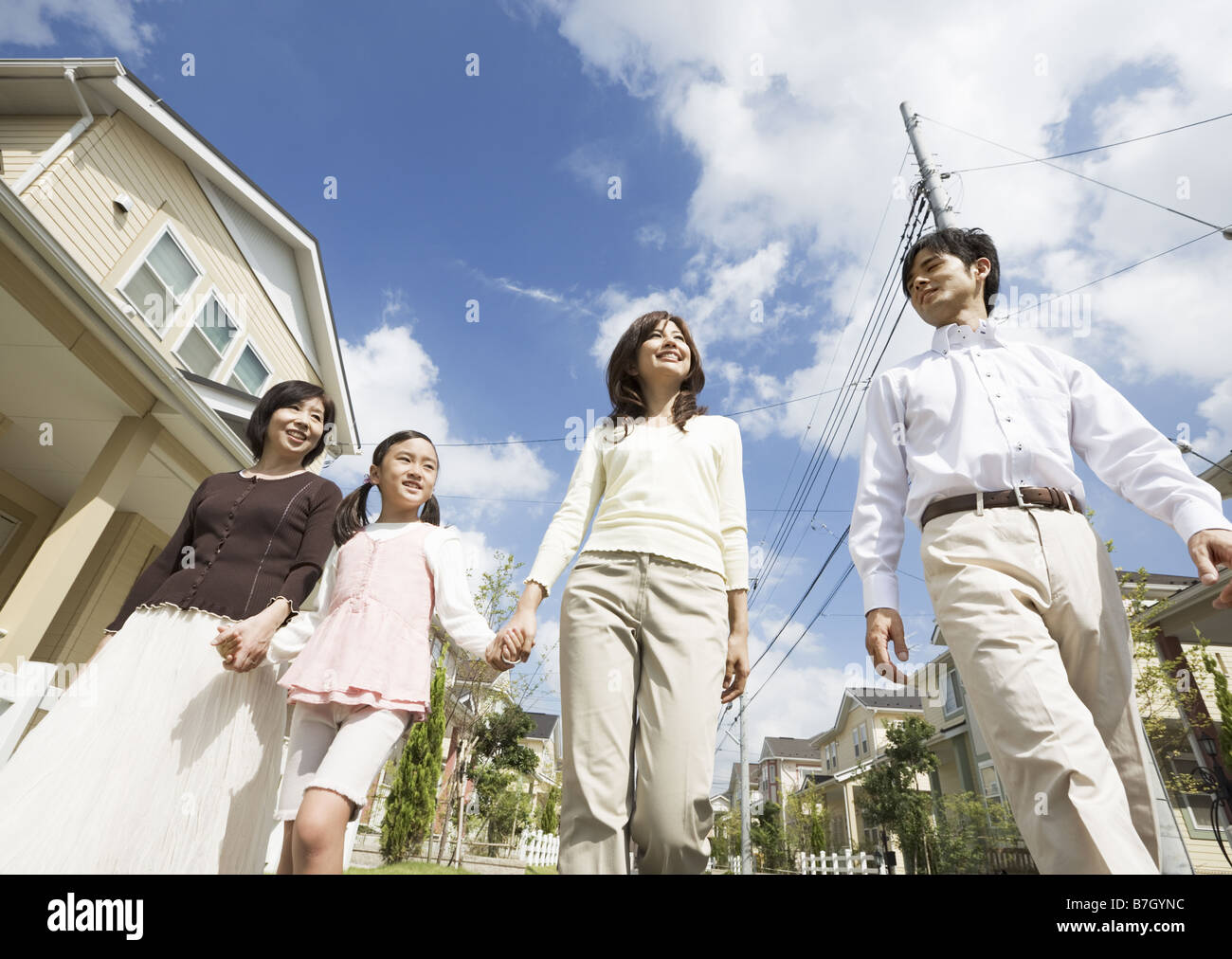 Family taking a walk Stock Photo - Alamy
