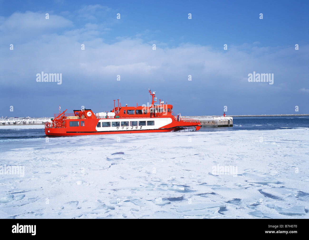 Drift ice and ice breaking ship Stock Photo - Alamy