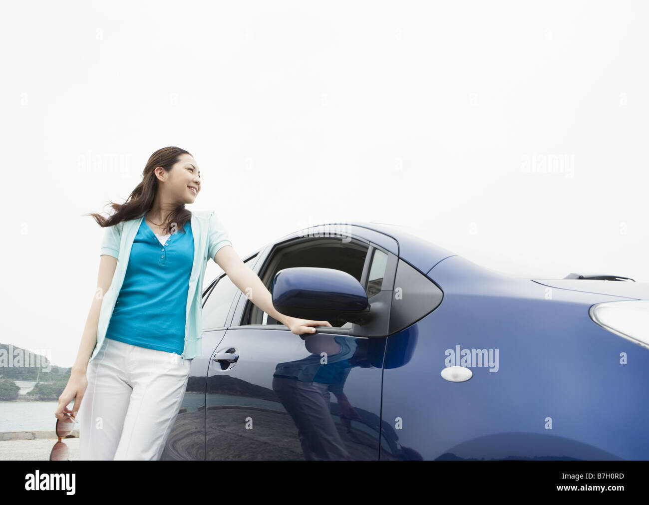 A young woman with a car Stock Photo - Alamy