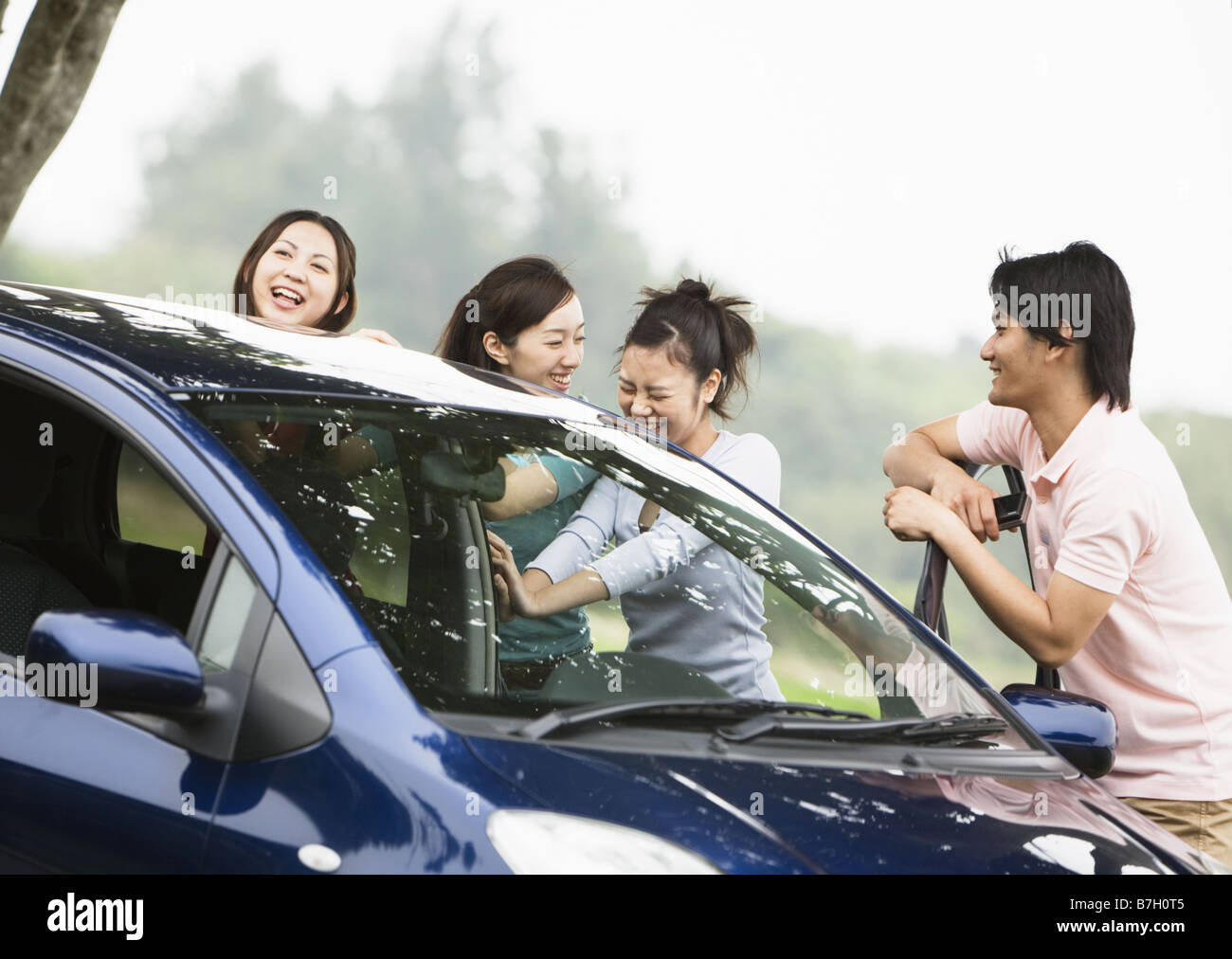 Young people with a car Stock Photo - Alamy