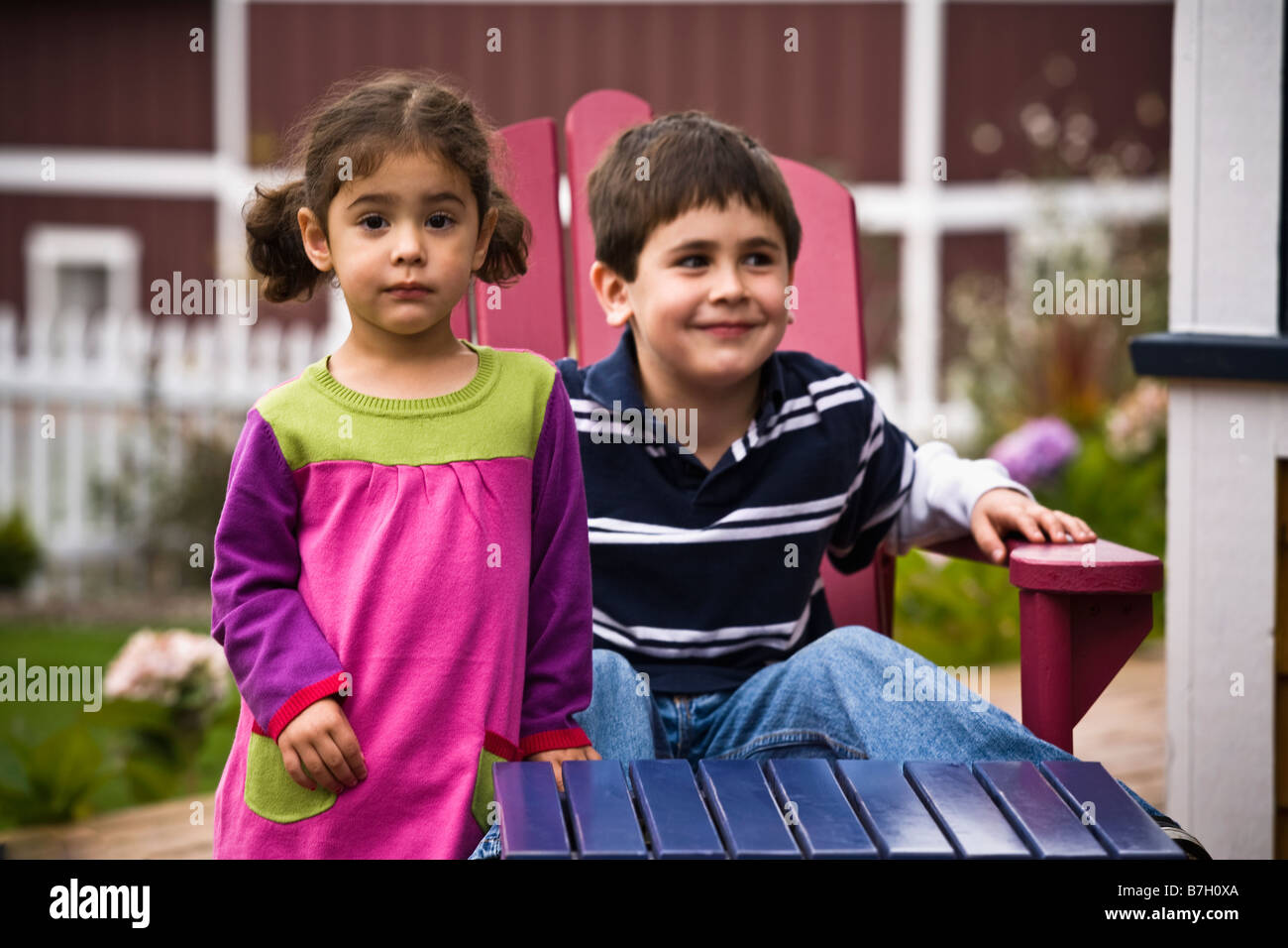 Brother and sister in backyard Stock Photo - Alamy