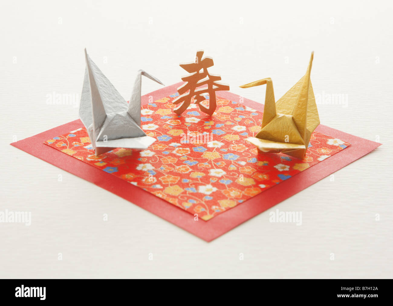 Folded paper crane Stock Photo - Alamy