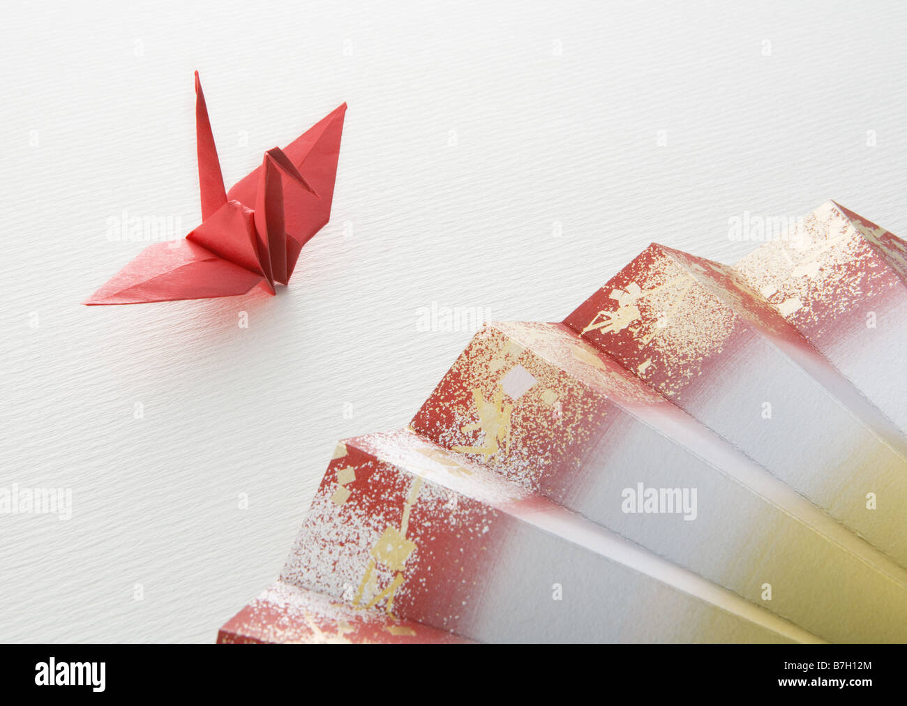 Folded paper crane Stock Photo - Alamy