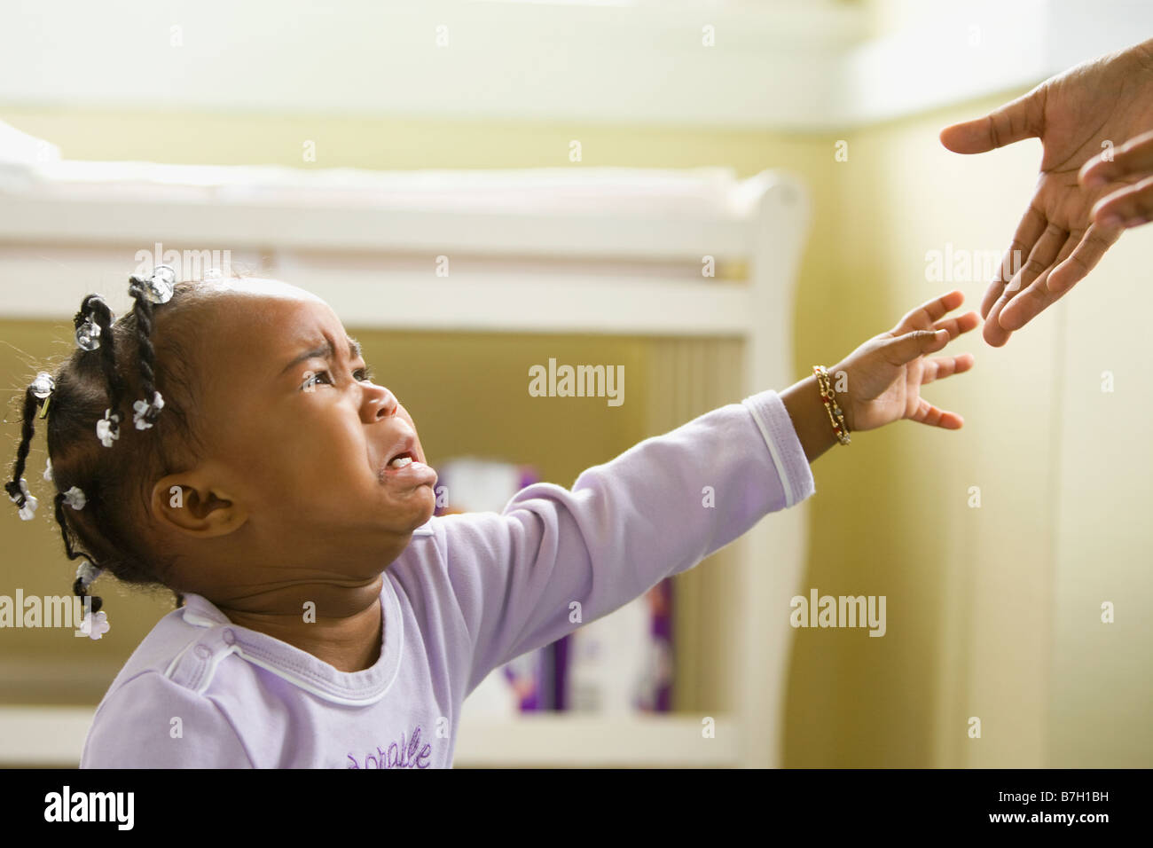 African girl crying and reaching upward Stock Photo - Alamy