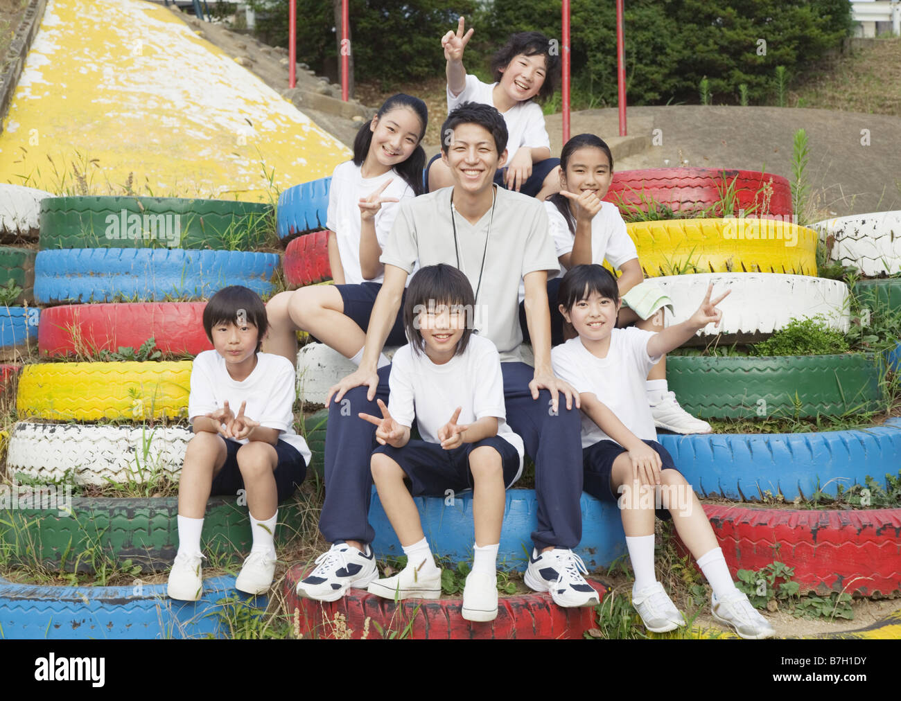 Elementary students and teacher Stock Photo - Alamy