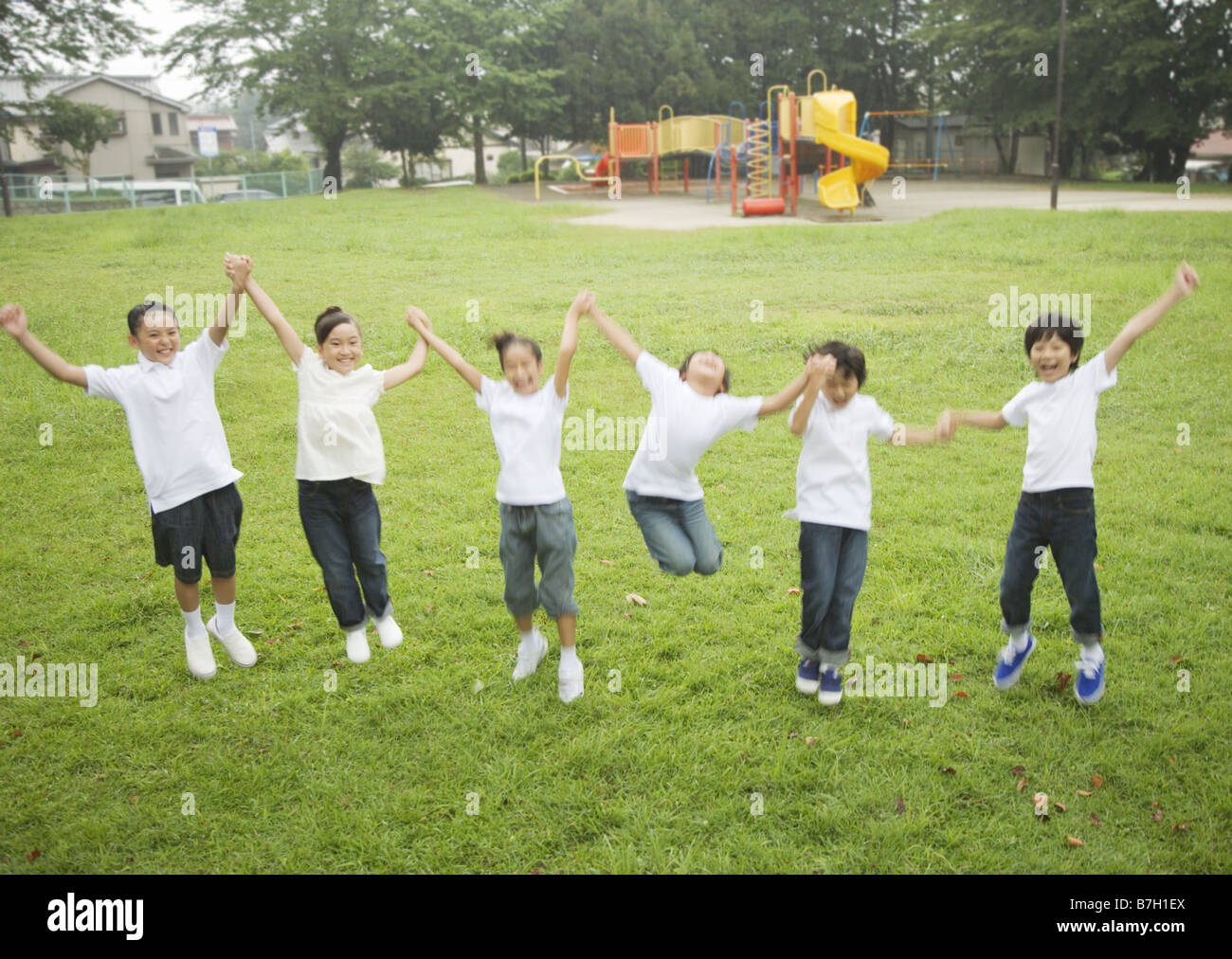 School children boy girl raise hands hi-res stock photography and ...