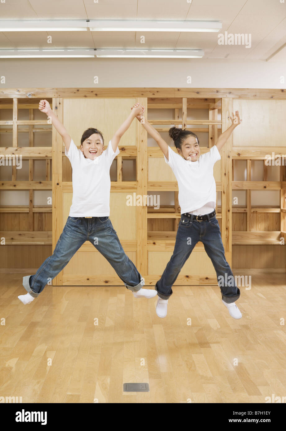 Children Jumping Classroom Stock Photos & Children Jumping Classroom ...