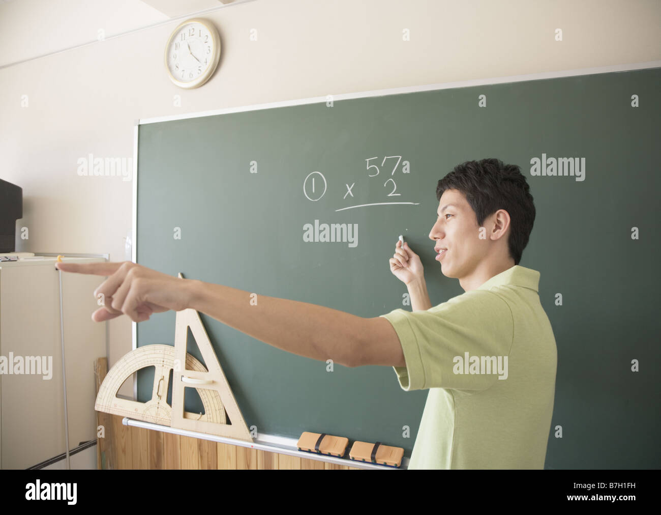 Teacher giving a math class Stock Photo - Alamy